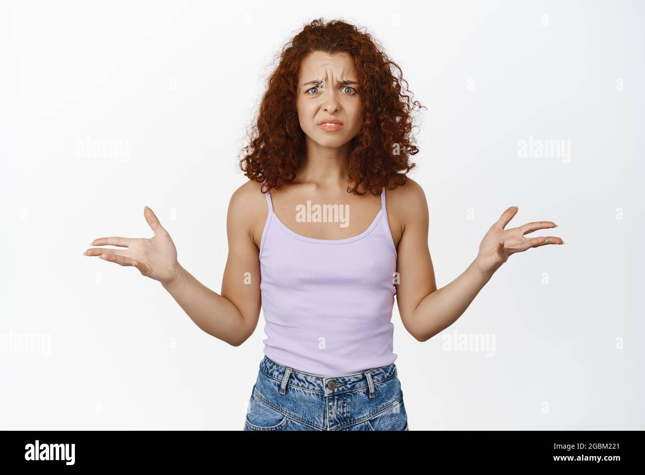 Whats Happening Frustrated Redhead Girl Shaking Hands And Shrugging Confused Cant Understand