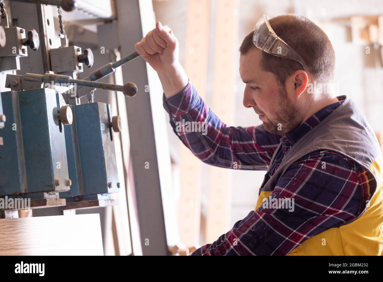 Closeup view man holding hydraulic press lever Stock Photo - Alamy