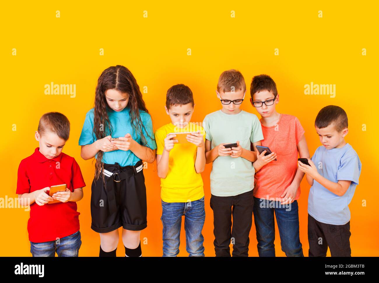 Young kids playing game on mobile phone Stock Photo - Alamy