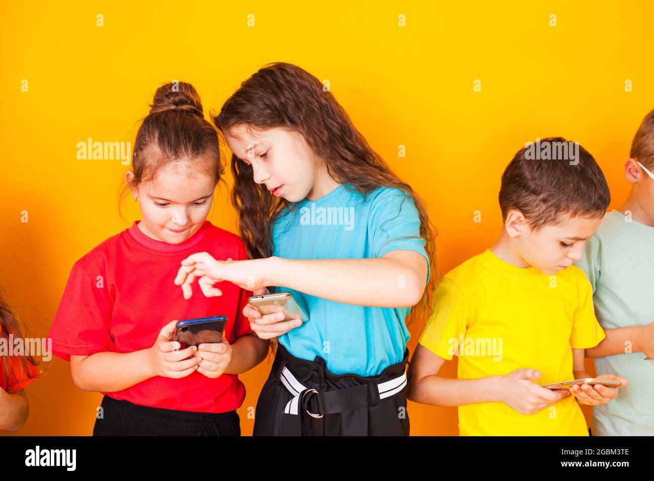 Young kids playing game on mobile phone Stock Photo - Alamy
