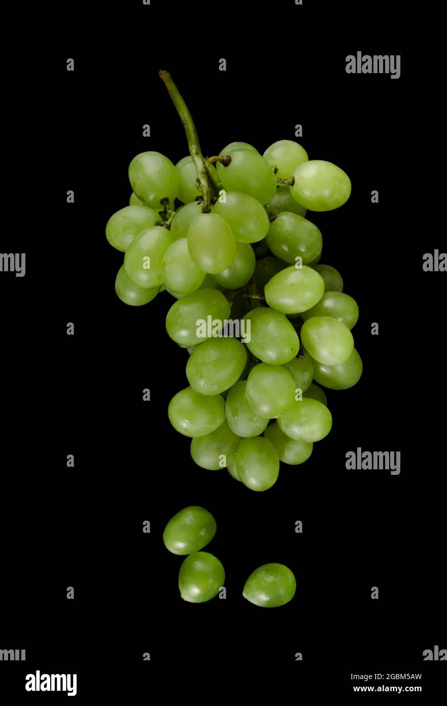 White pouring grapes, with large cubes on a black background isolated ...