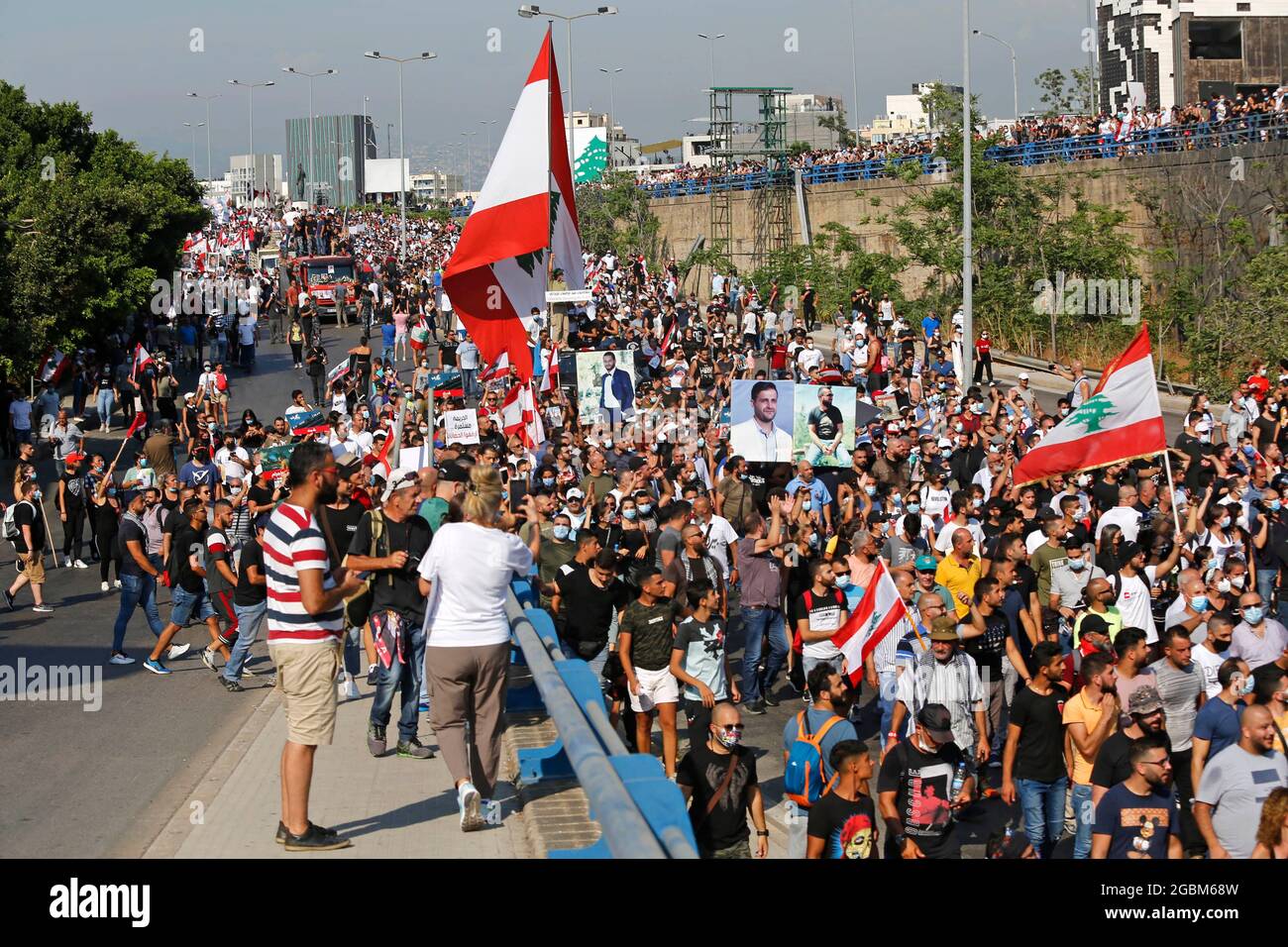 Beirut, Lebanon. 4th Aug, 2021. People take part in a protest at the ...
