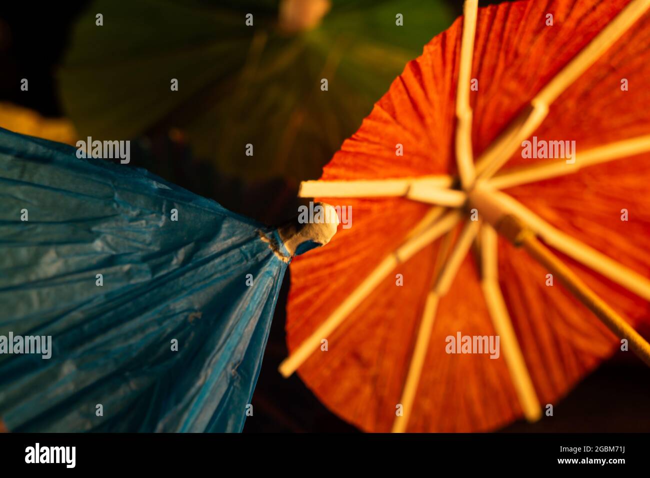 Umbrellas of different colors on a black background Stock Photo - Alamy