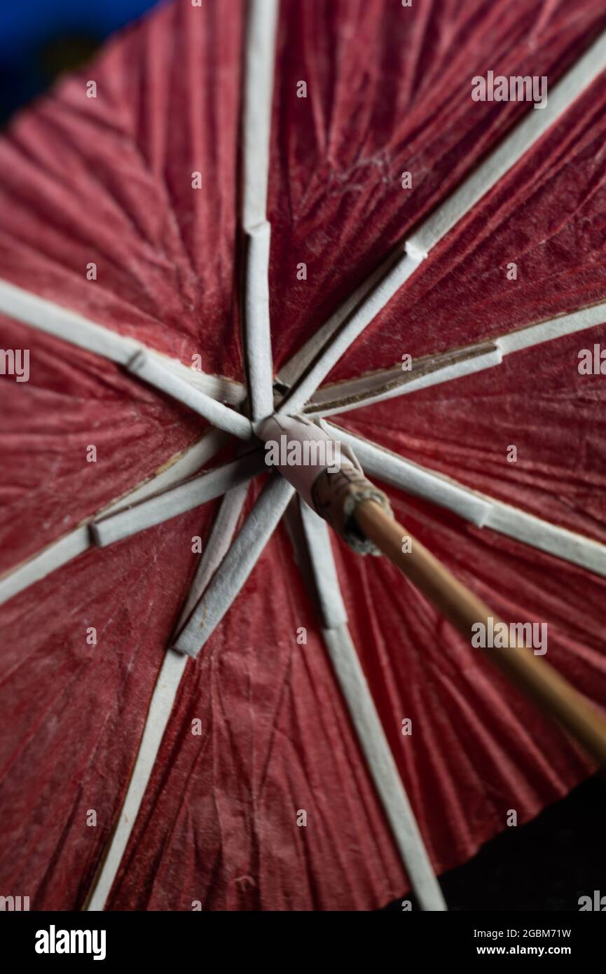 Red umbrella from inside on a black background Stock Photo - Alamy