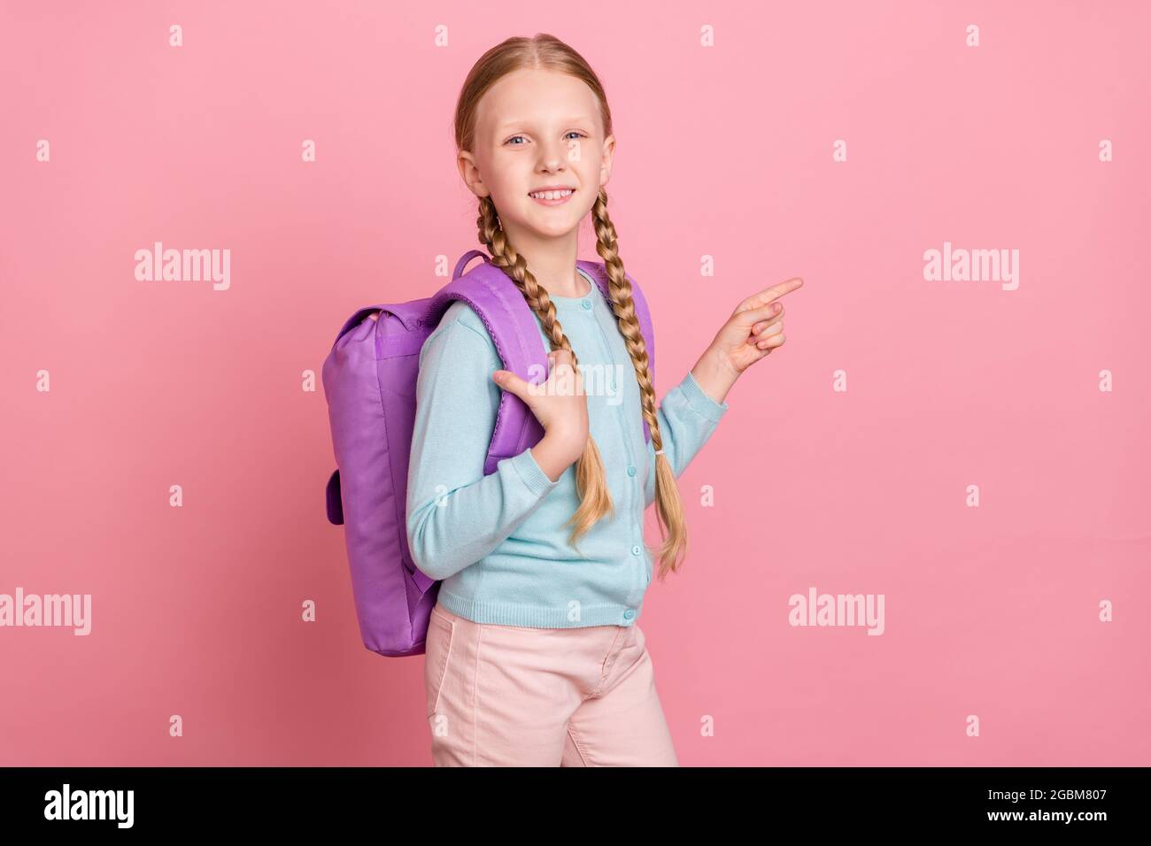 Photo of excited cute schoolgirl dressed blue cardigan smiling backpack ...