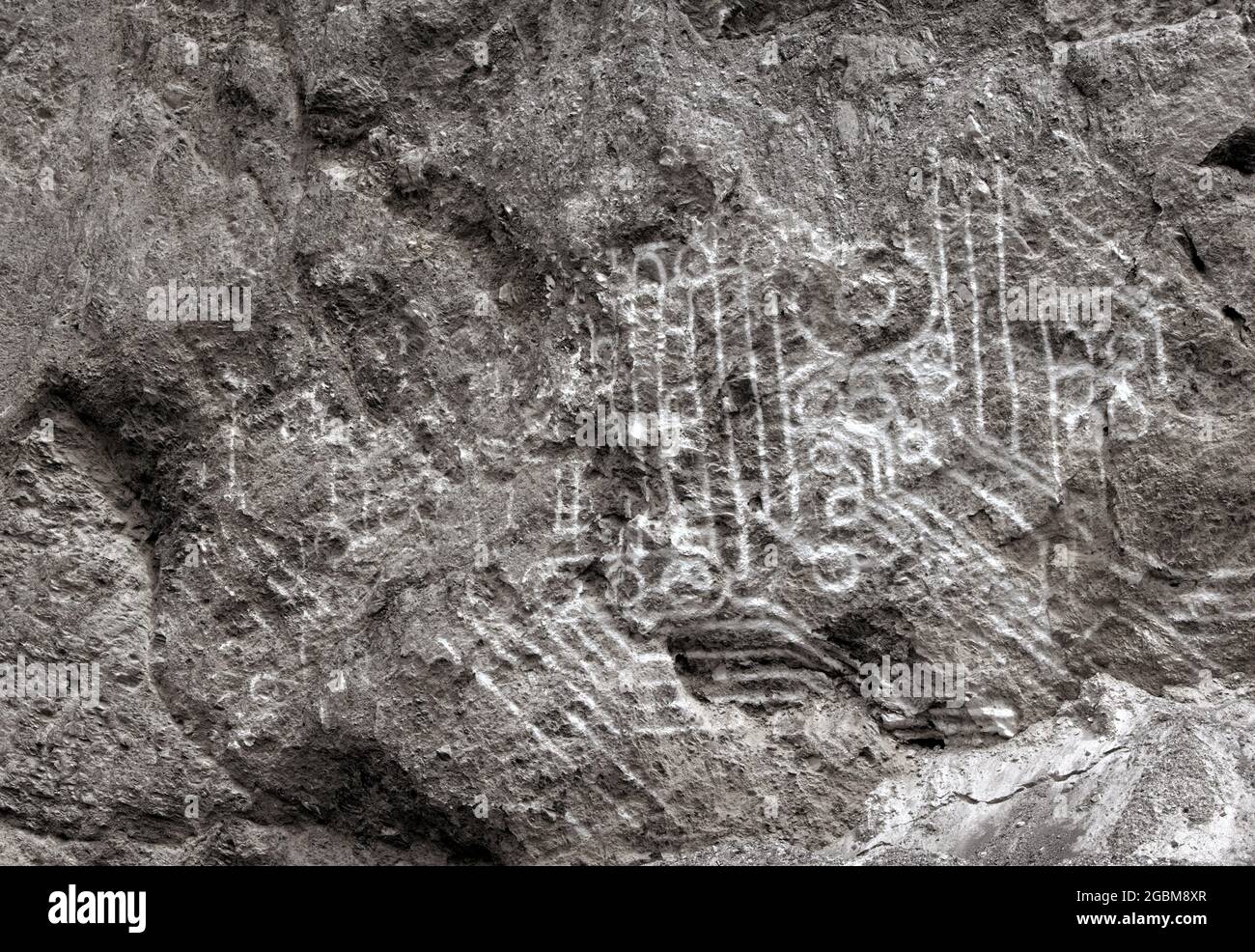 Cryptic symbols etched into rock face in the Grisonian Rhine gorge ...