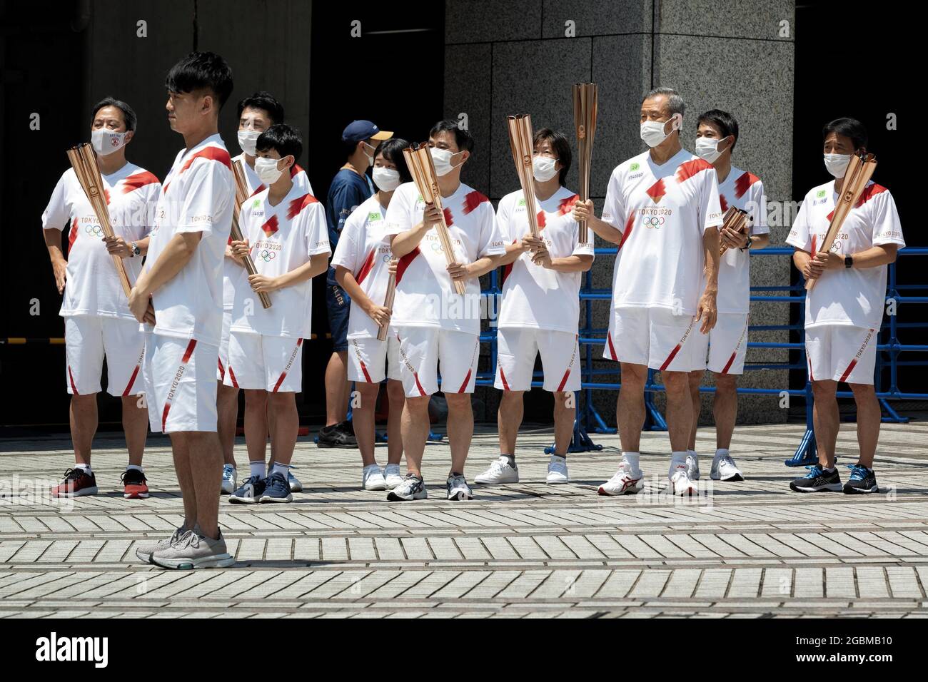 Torchbearers doing the official "Torch kiss" ceremony, during the ...
