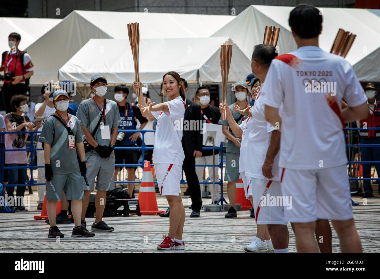 Torchbearers doing the official "Torch kiss" ceremony, during the ...