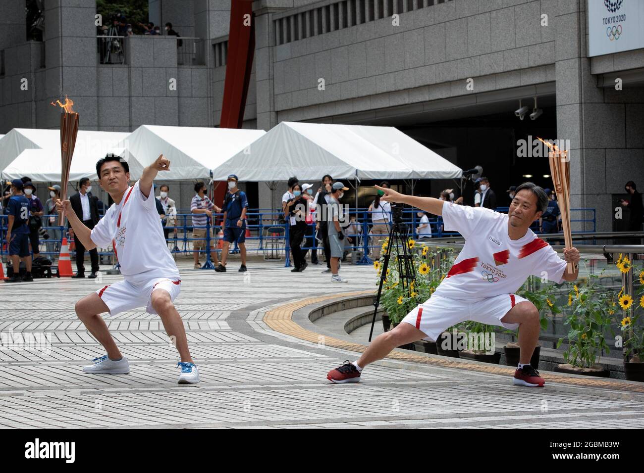 Torchbearers performing at the official "Torch kiss" ceremony, during ...