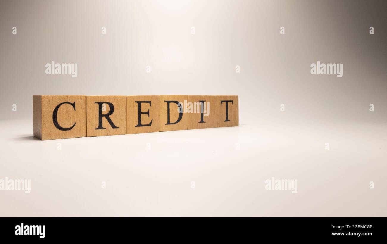 Credit name created from wooden letter cubes. Economics and finance ...
