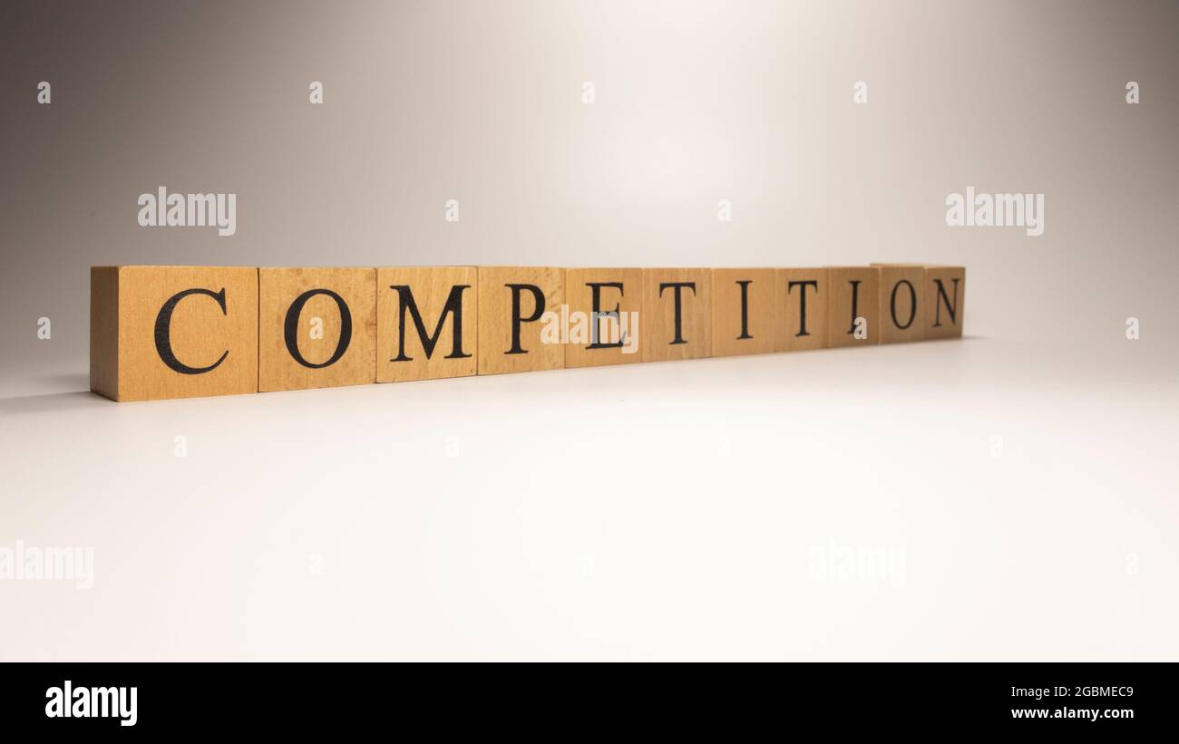The name Competition was created from wooden letter cubes Stock Photo ...