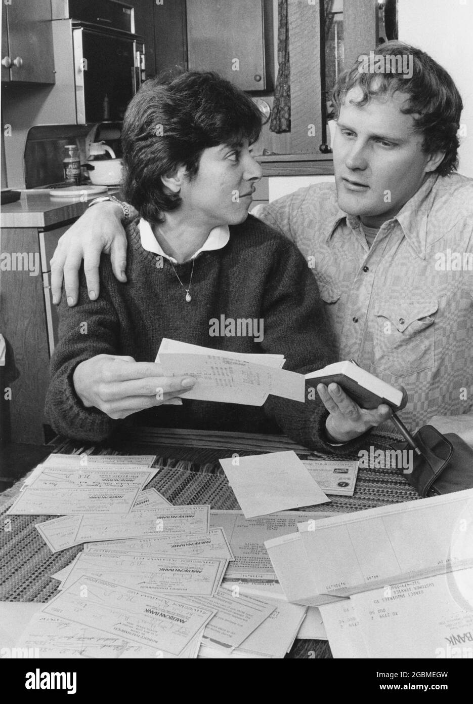 Austin, Texas USA, circa 1989 Husband and wife working on their ...