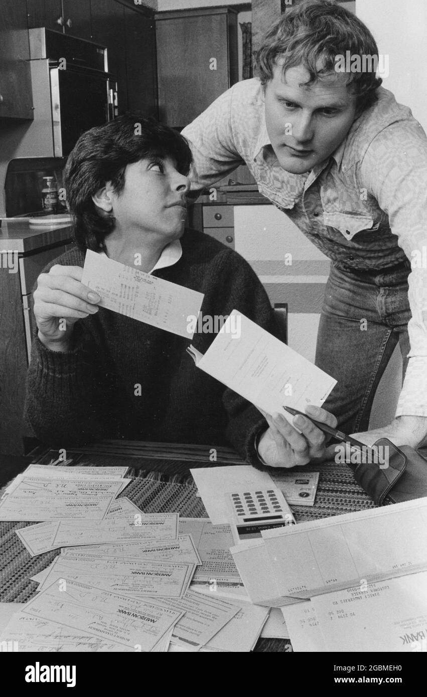 Austin, Texas USA, circa 1989 Husband and wife working on their ...