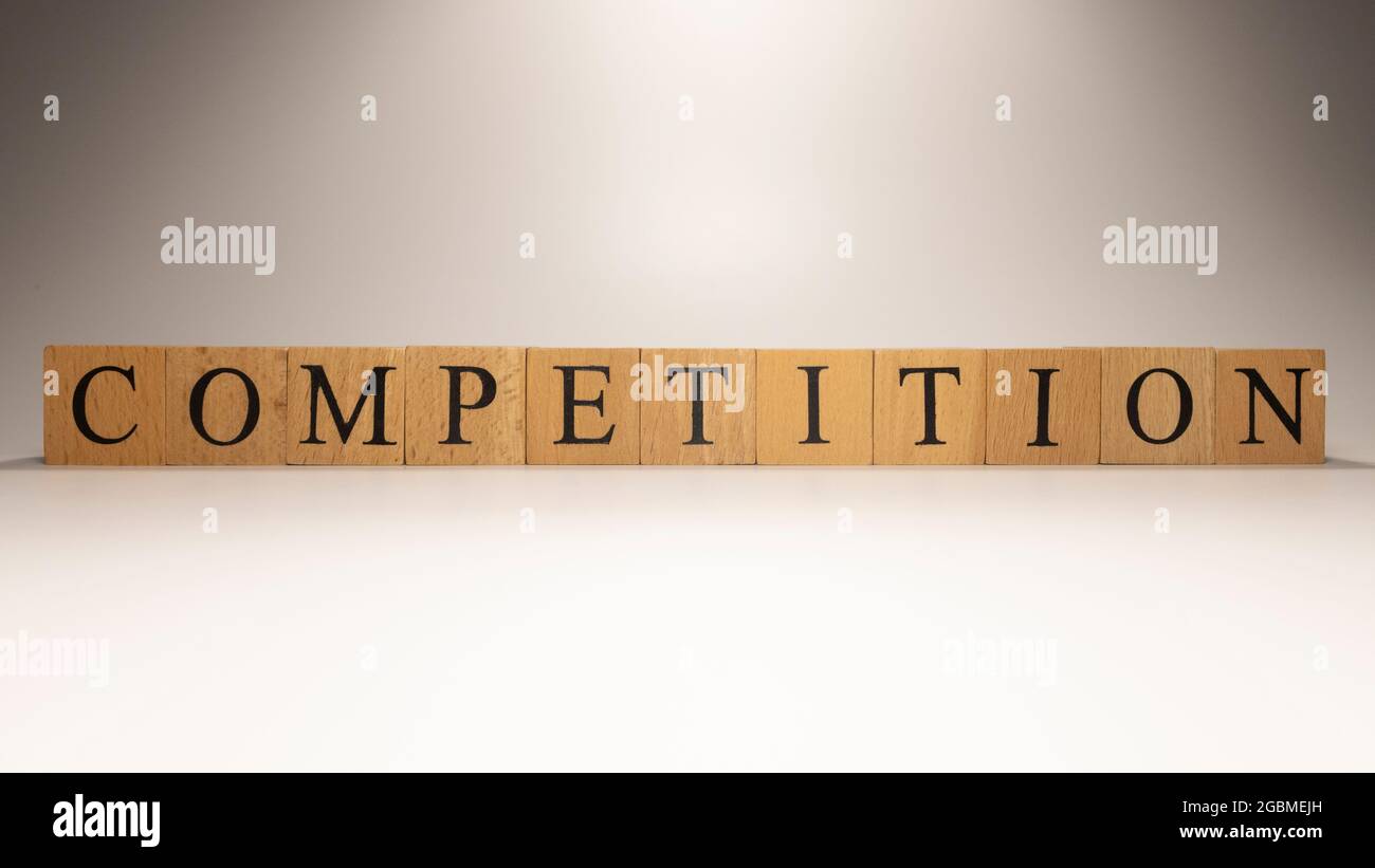 The name Competition was created from wooden letter cubes Stock Photo ...