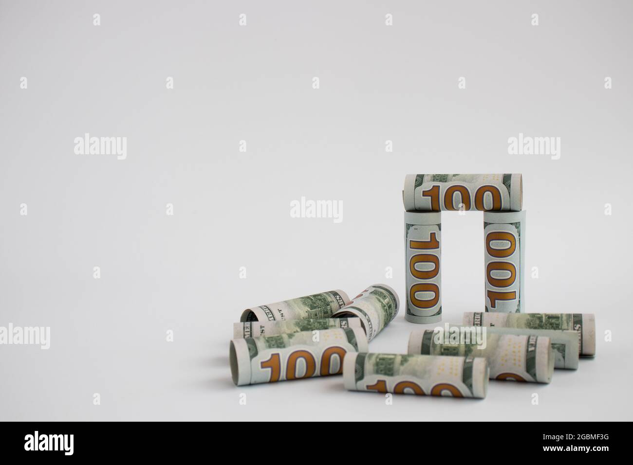 Construction from rolled American dollars. Money constructor Stock ...