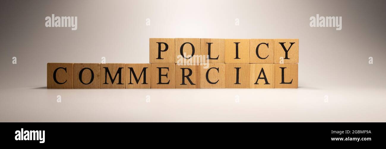 The name Commercial policy was created from wooden letter cubes Stock ...