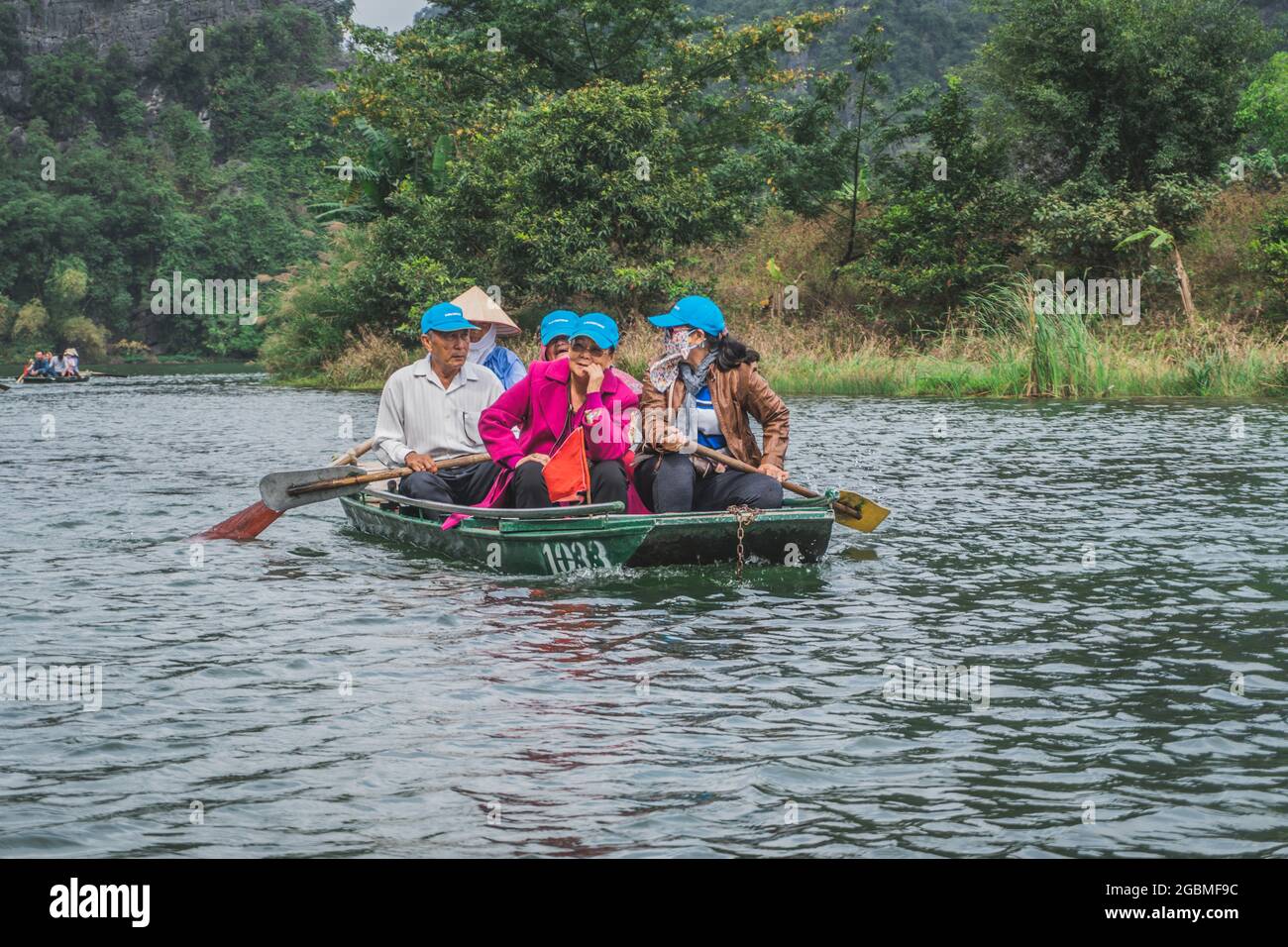 A lot of people are boating on a lake in Vietnam. Ninh Binh, Vietnam ...