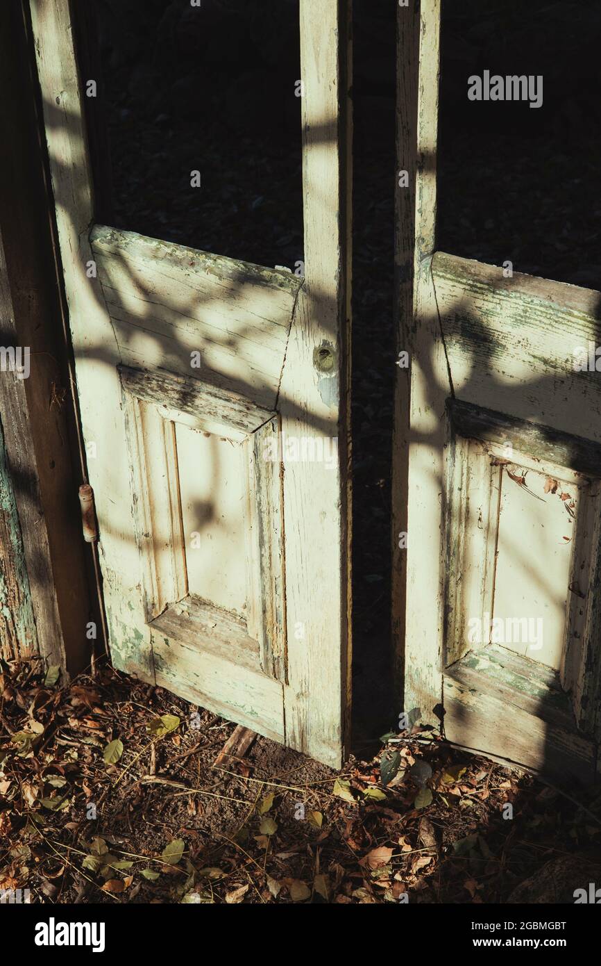 Vertical shot of an old white wooden door of an abandoned house Stock ...