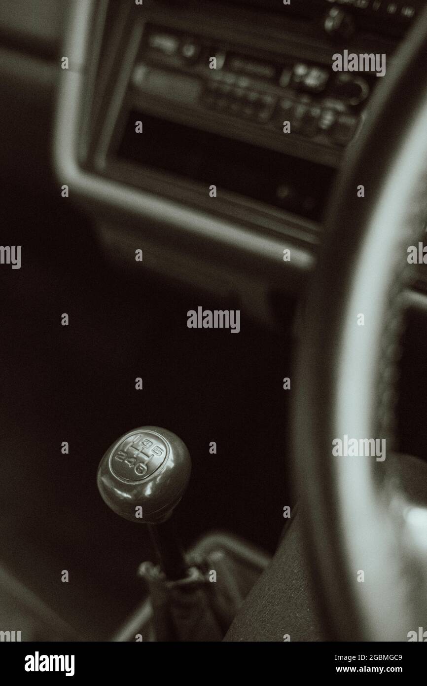 Vertical shot of a gear shift in a black car interior Stock Photo - Alamy