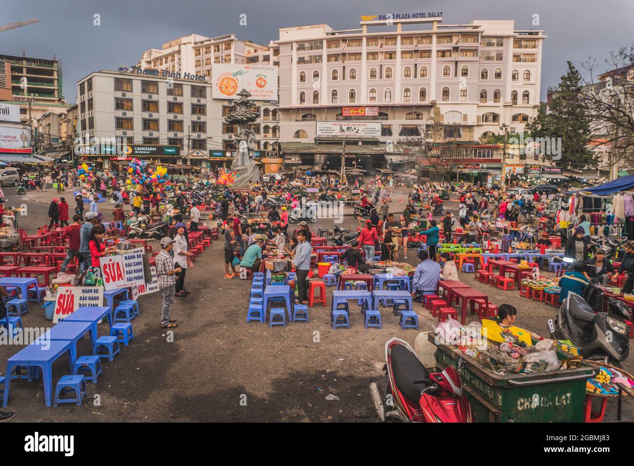 People buy and sell seafood and vegetable on the street food market in ...