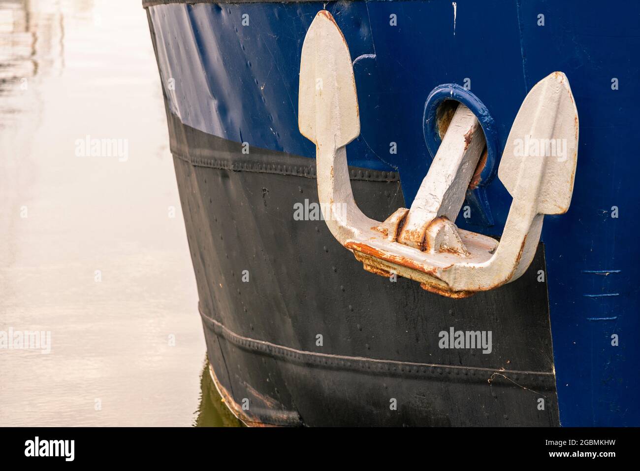 High angle shot of a white painted anchor and the parked ship fragment ...
