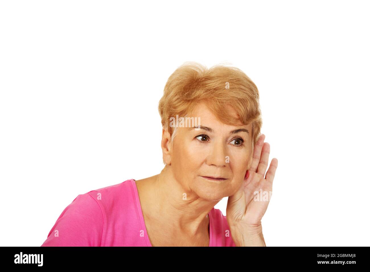 Portrait of an old sneaky Polish woman in a summer outfit eavesdropping ...