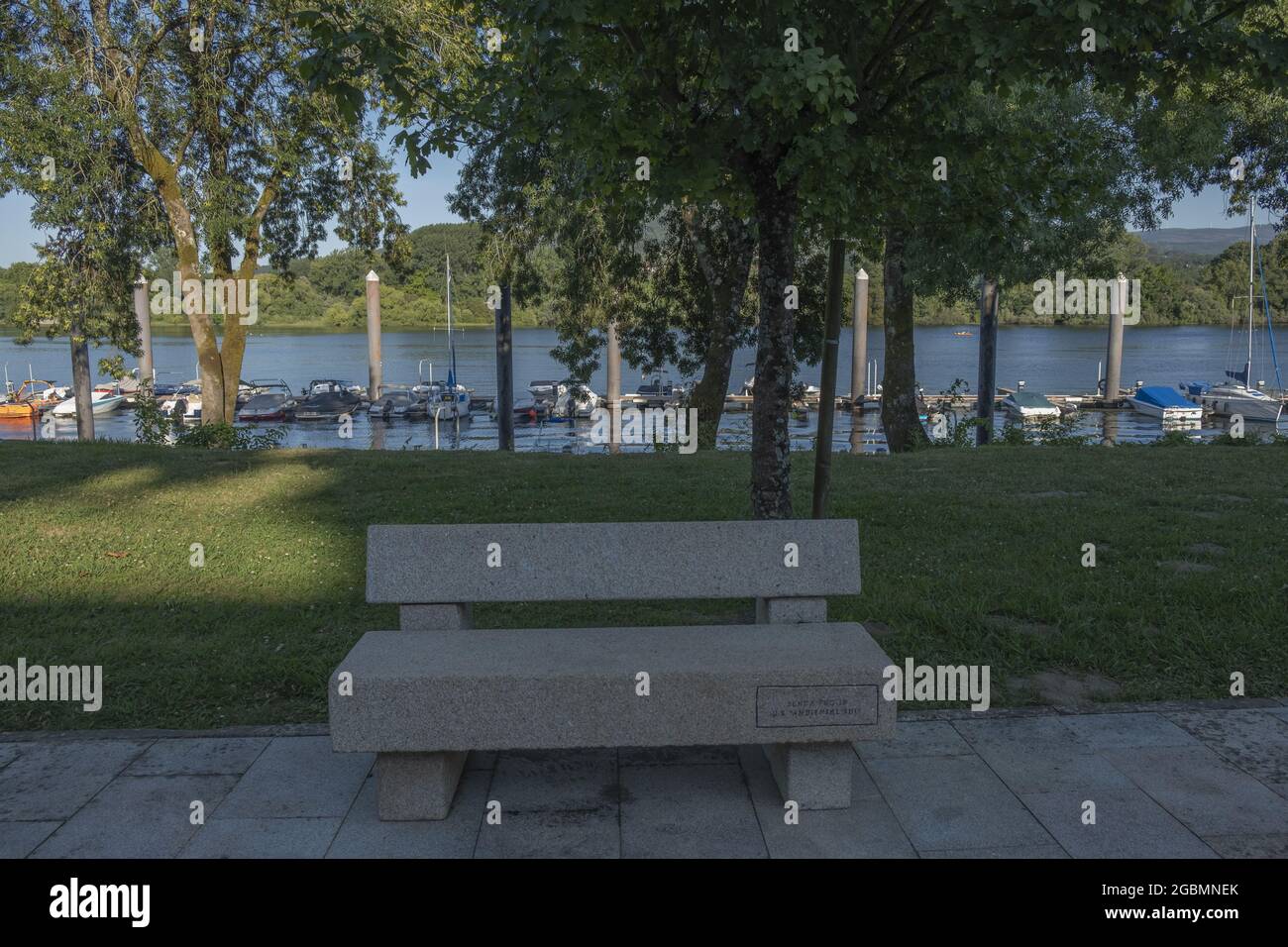 TUY, SPAIN - Jul 15, 2021: A stone bench on the park in Tuy, Spain ...