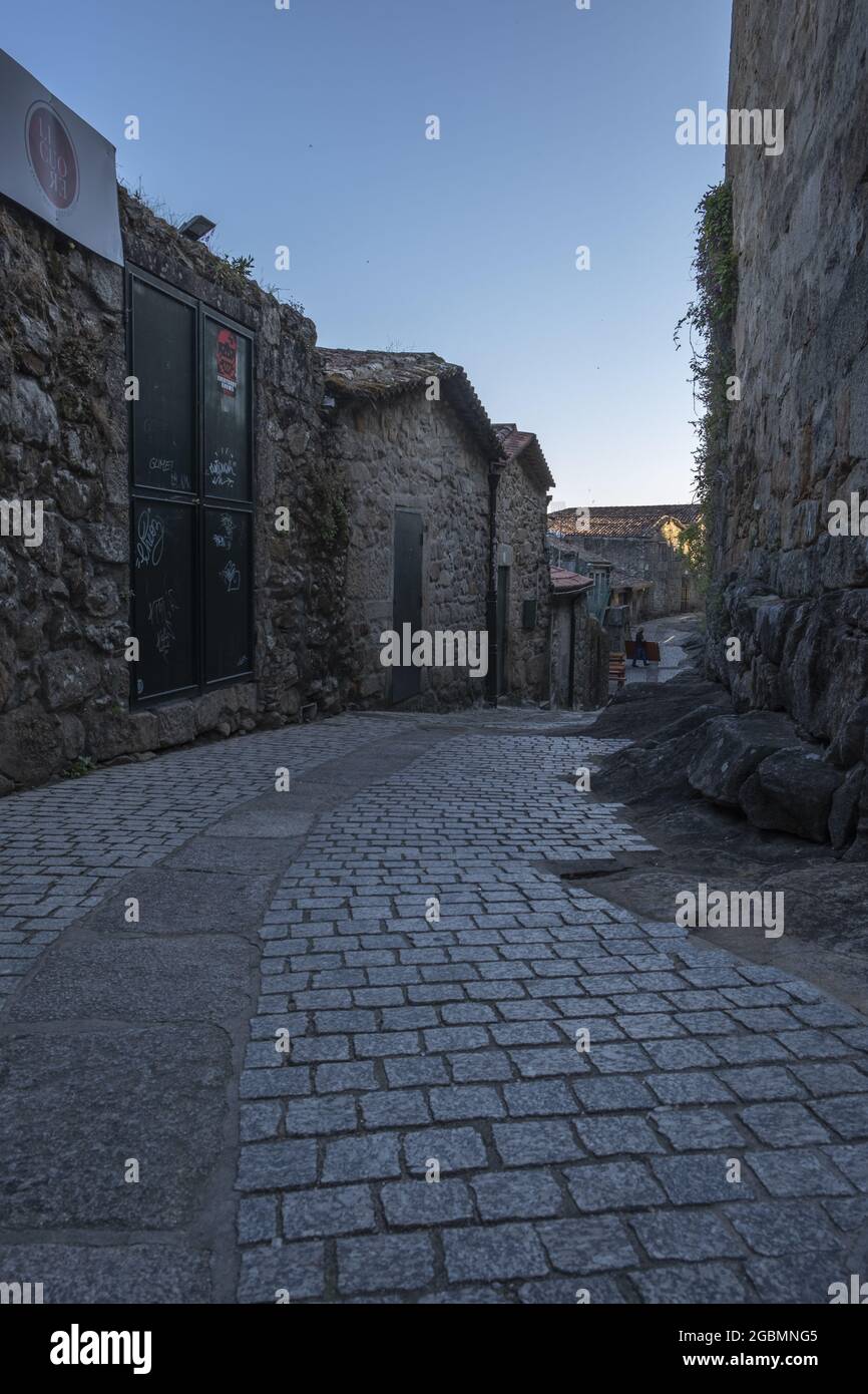 TUY, SPAIN - Jul 15, 2021: A vertical shot of a narrow footpath between ...