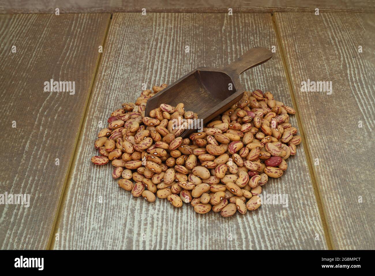 red kidney beans in wooden spoon isolated on dark background Stock ...