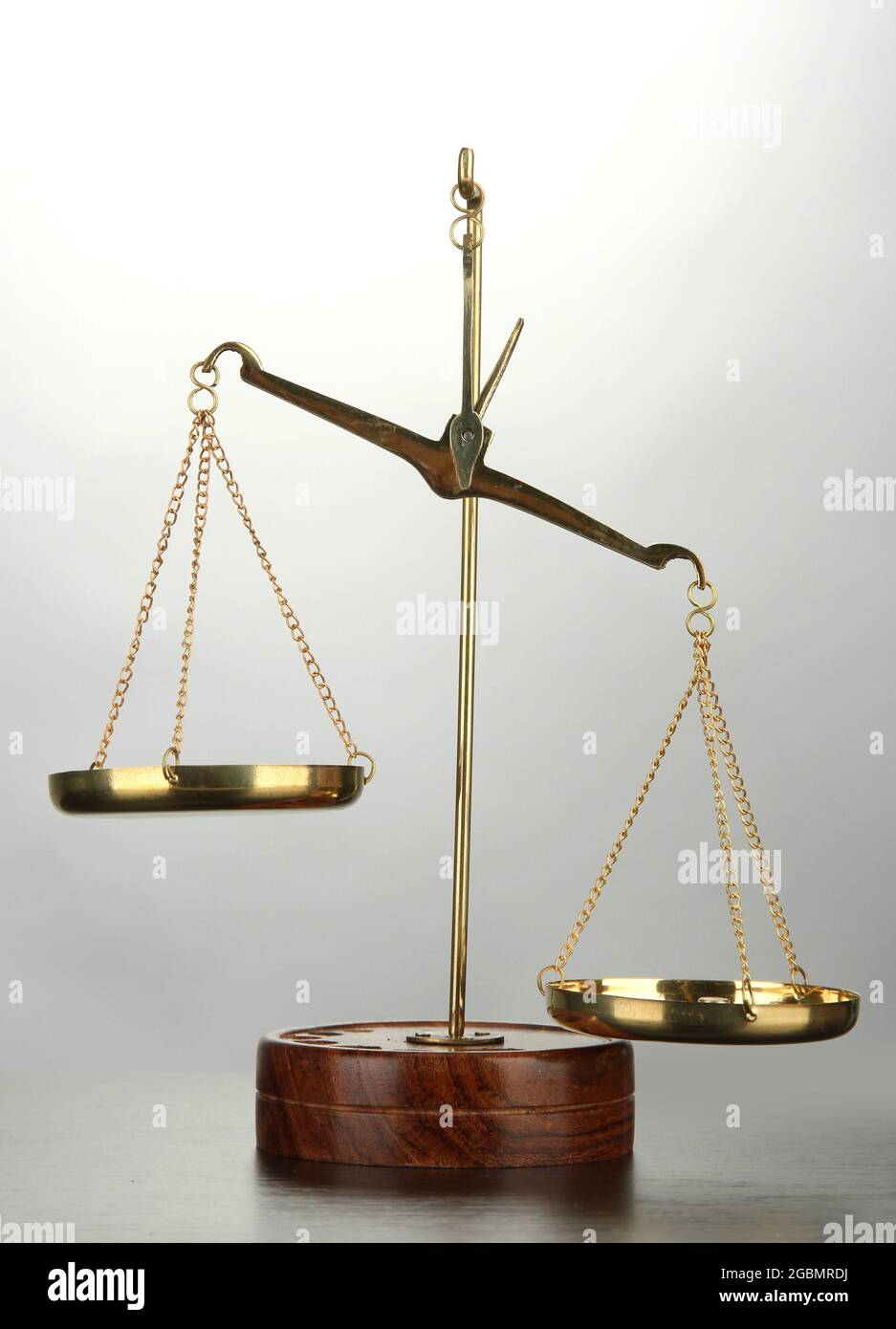 Gold scales of justice on grey background Stock Photo - Alamy
