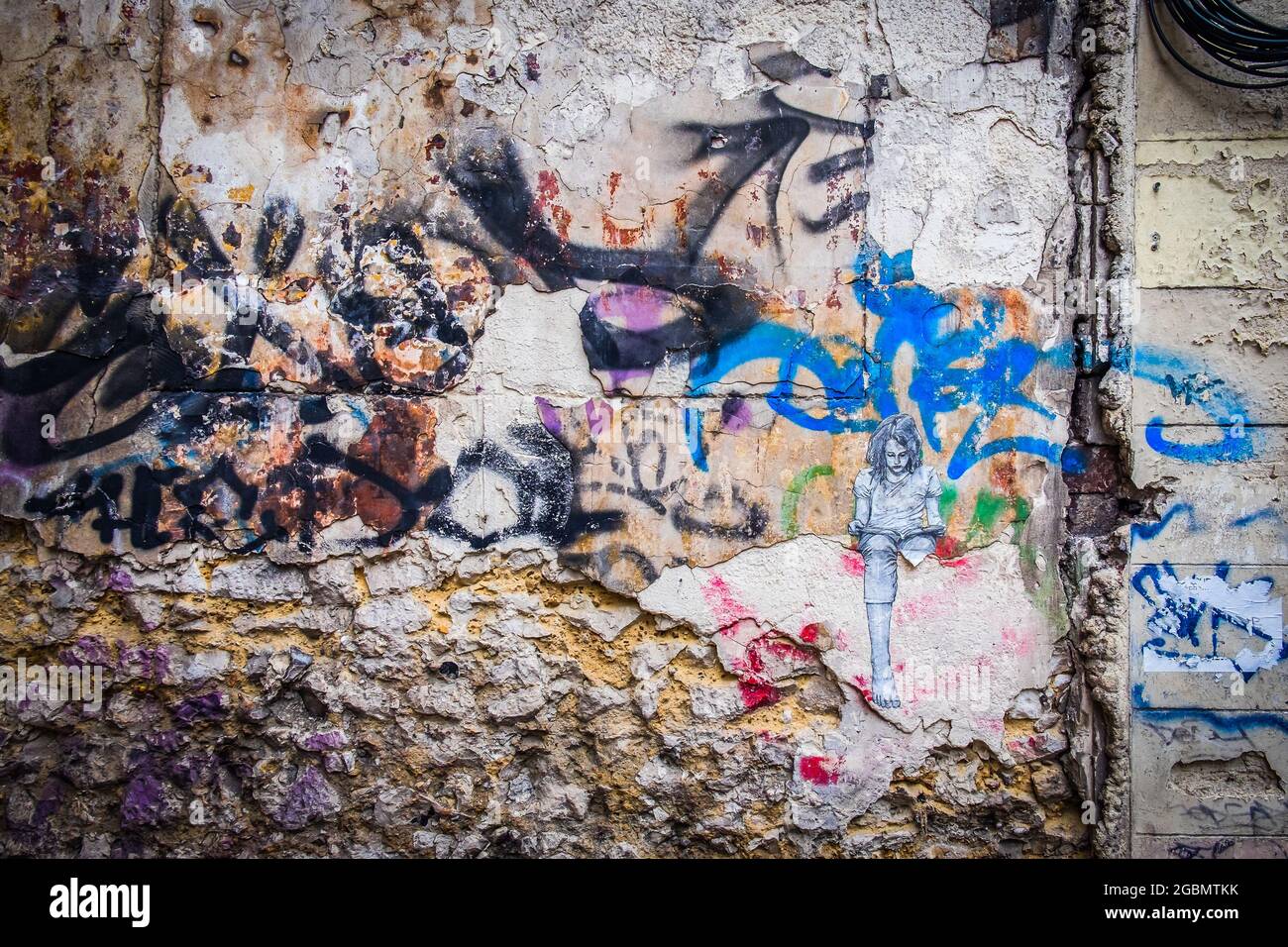 Rouen, France, Oct 2020, graffiti and a paper collage on a derelict ...