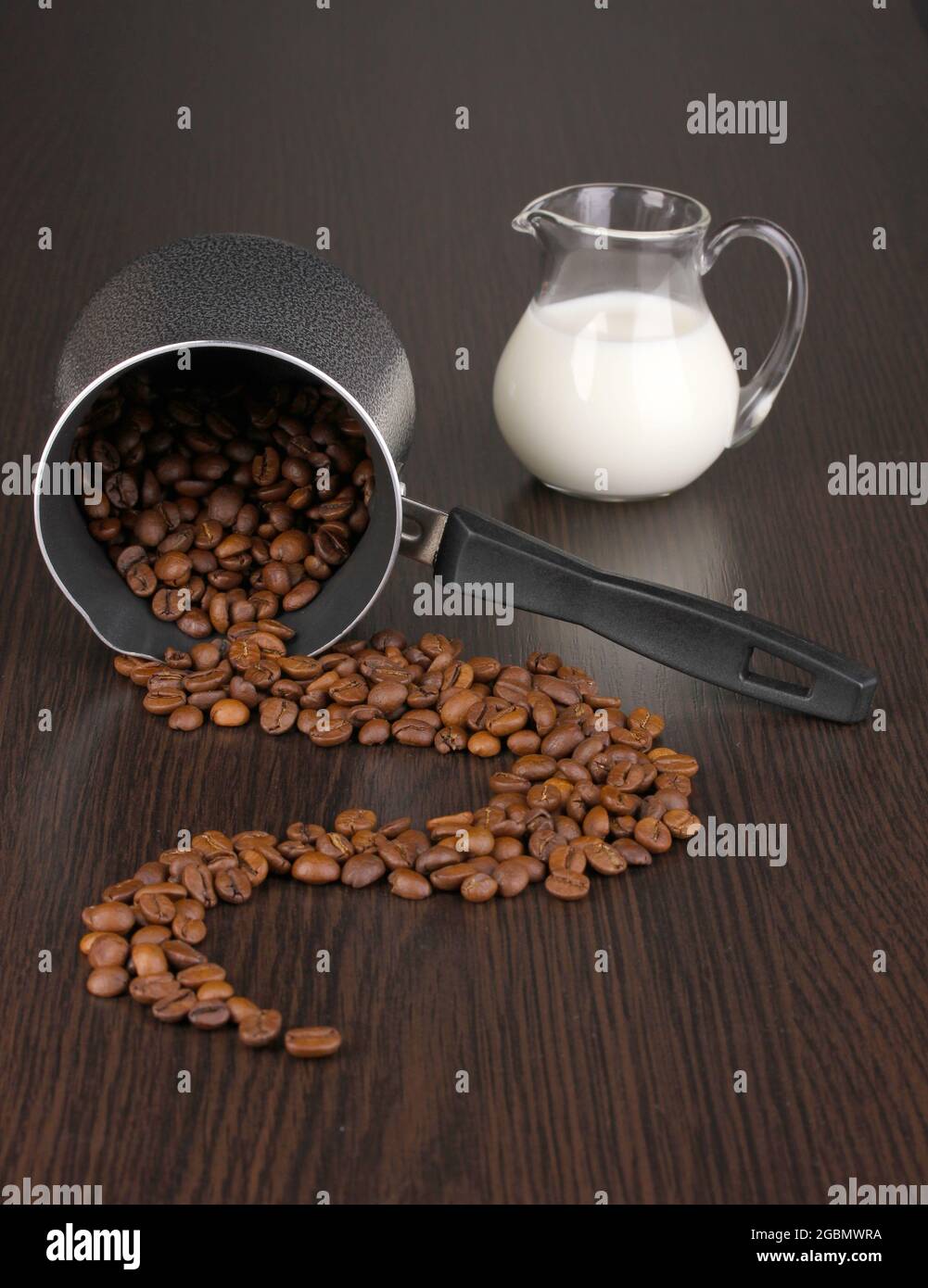 Coffee maker on brown table Stock Photo - Alamy