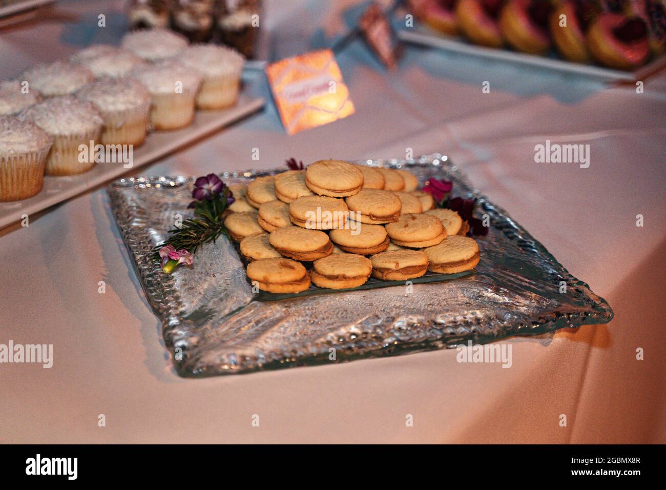 Dinner table with various types of delicious desserts Stock Photo - Alamy