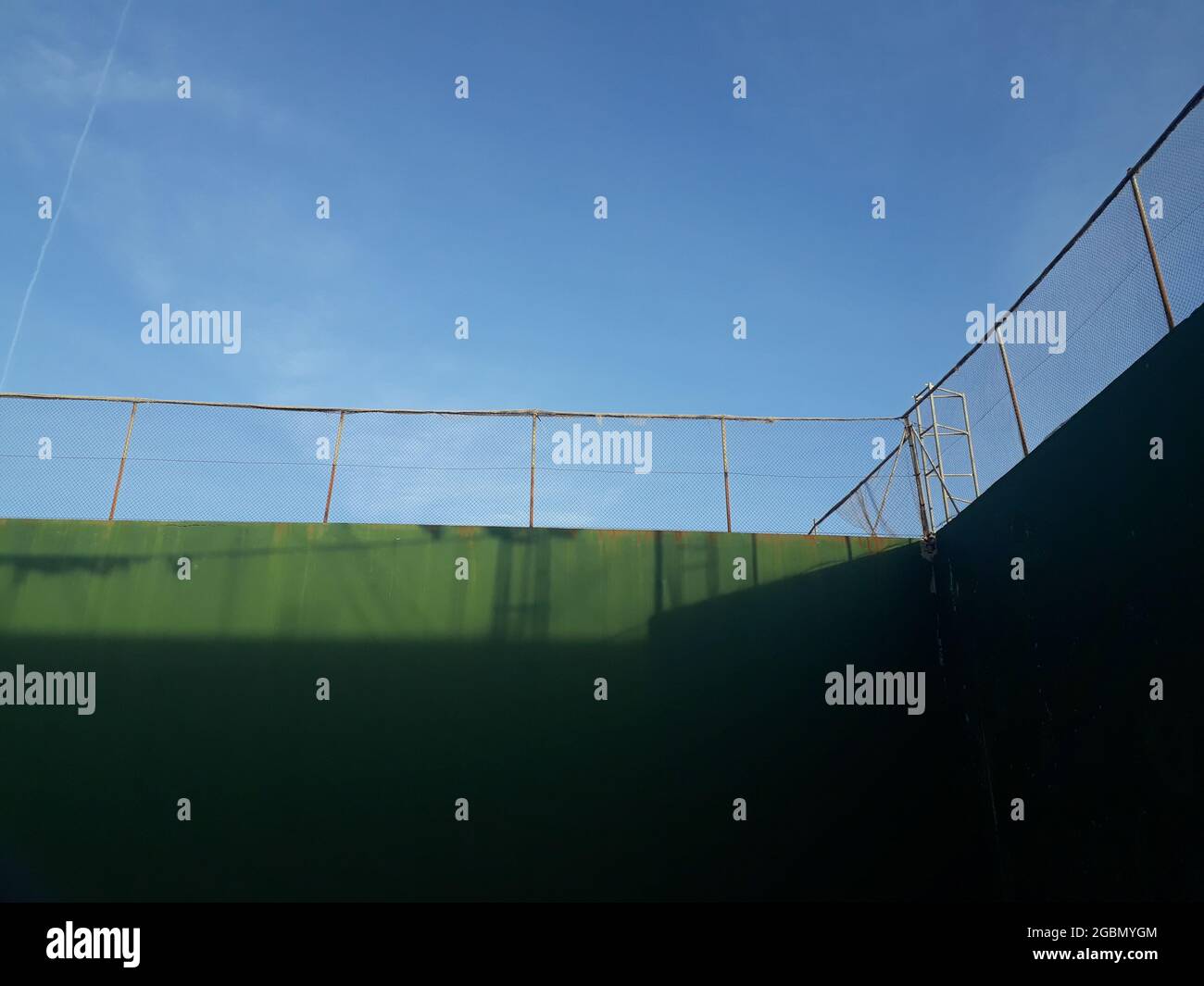 The high fences of a prison seen from the claustrophobic interior Stock ...