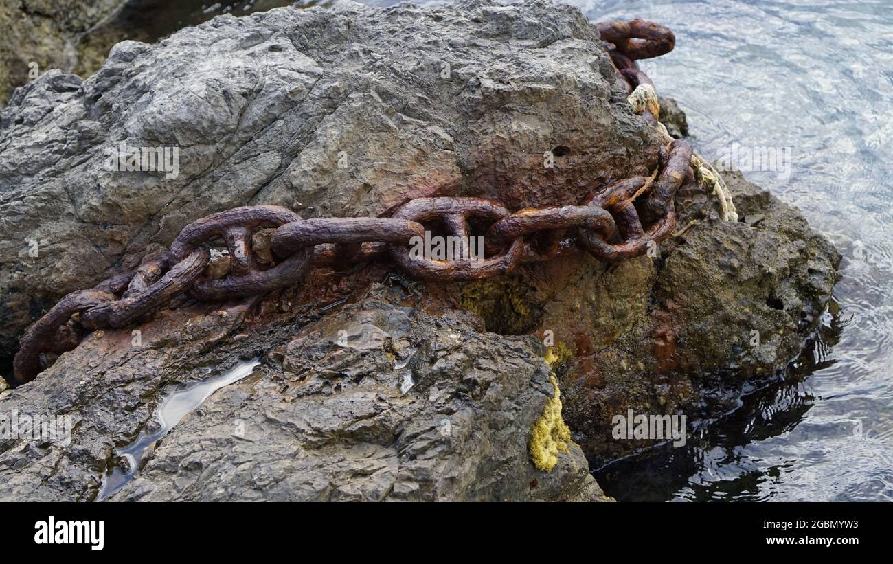 Old rusty chain at sea shore Stock Photo - Alamy