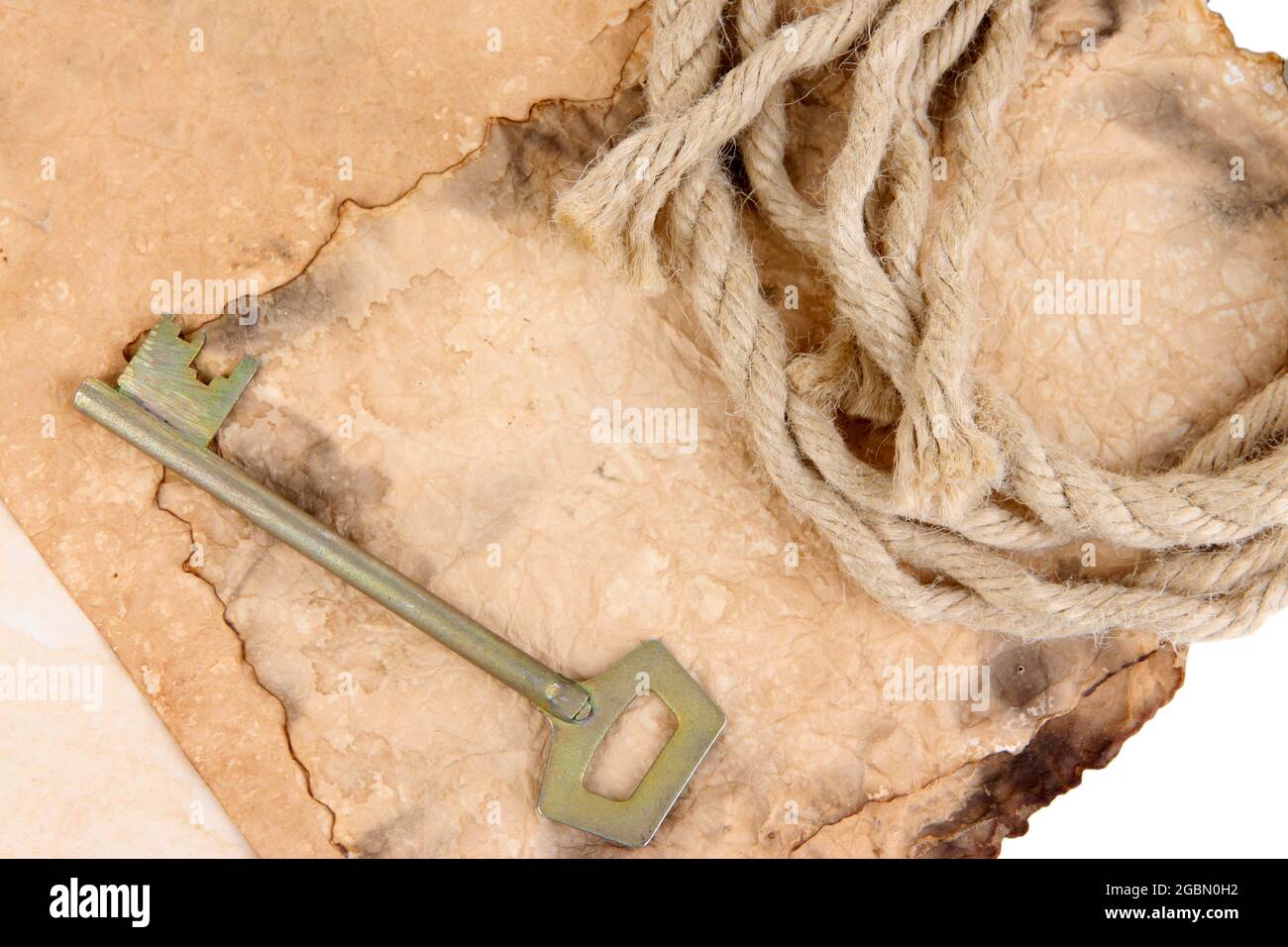 Old paper with key and rope close up Stock Photo - Alamy