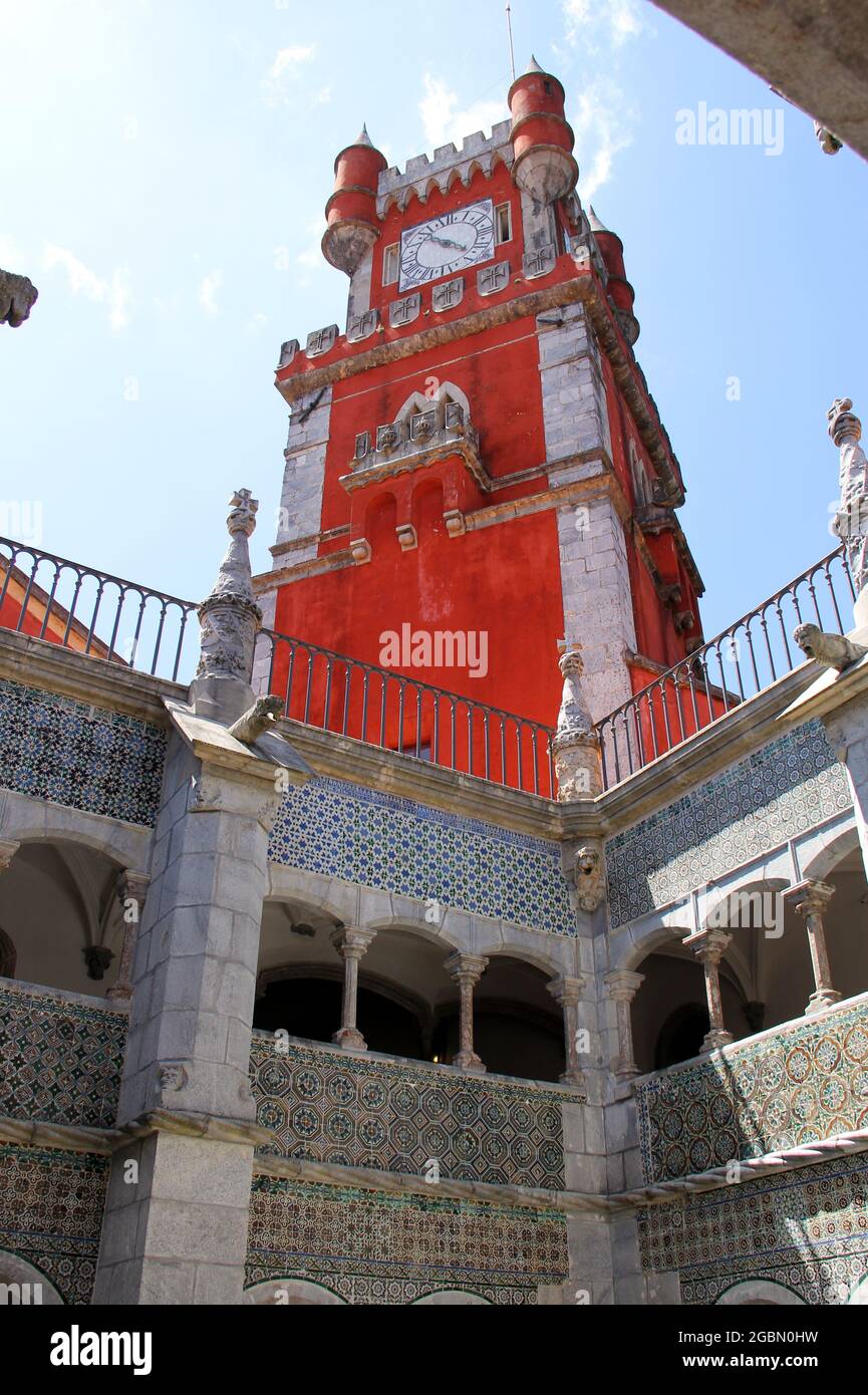 Red clock tower of the Pena Palace, view from the inner court of the ...