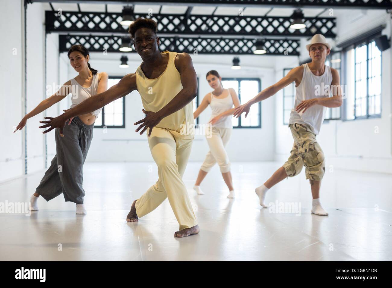 People practicing vigorous lindy hop movements in dance class Stock ...