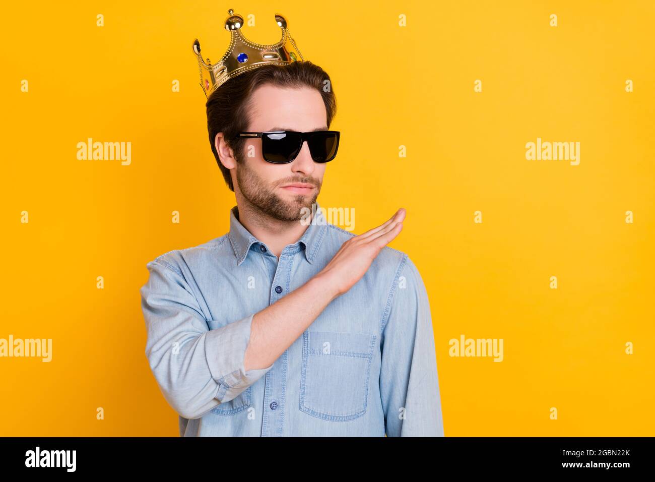 Photo of young narcissistic man rich arrogant serious prince crown look ...