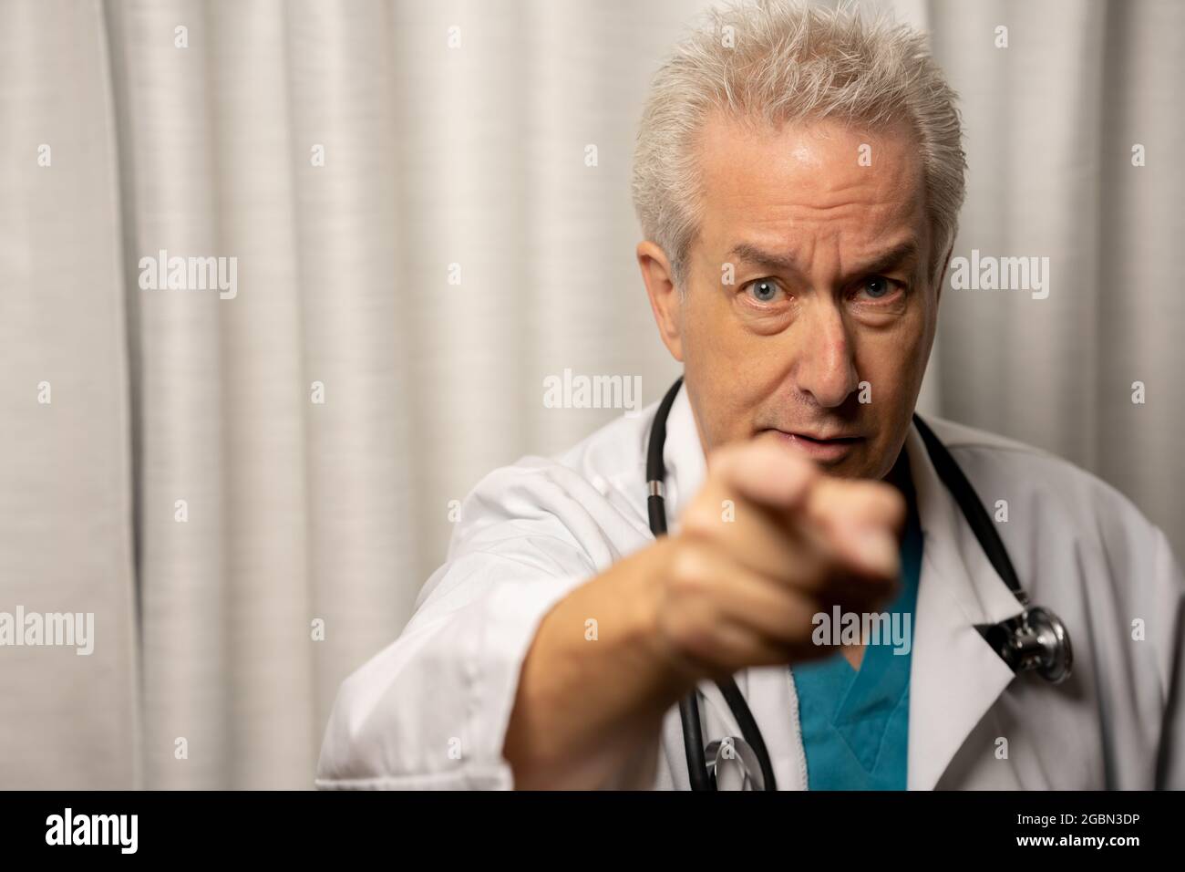 Photo of a doctor pointing his finger at you Stock Photo - Alamy