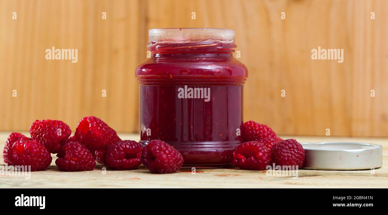 Canned raspberry jam Stock Photo - Alamy