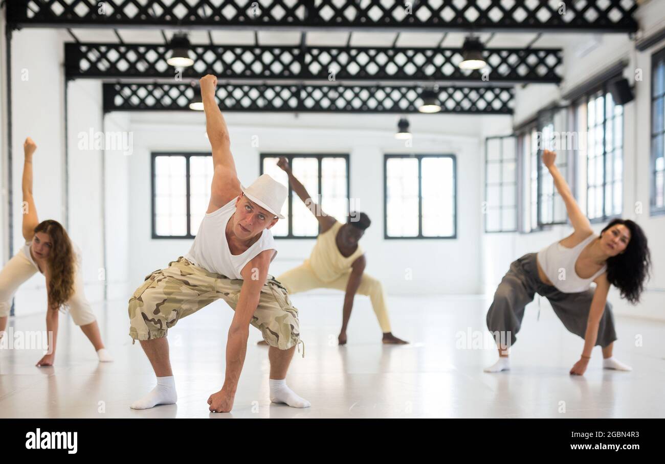 Group of people enjoying dancing together in studio Stock Photo - Alamy