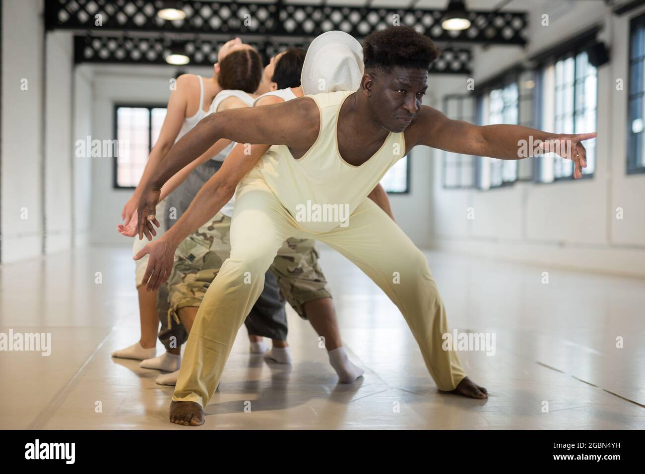 Four artists playing art performance Stock Photo - Alamy