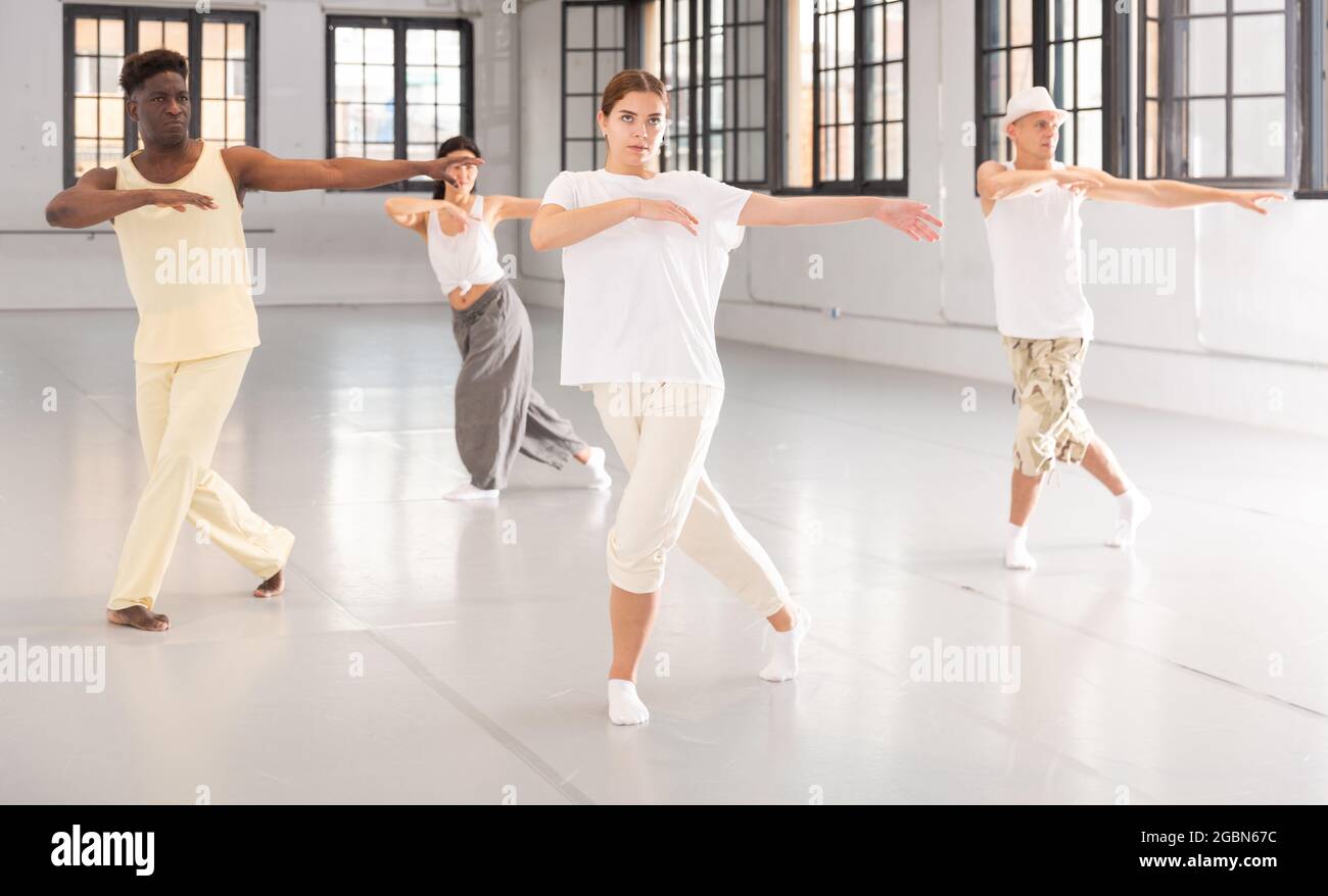 People practicing vigorous lindy hop movements in dance class Stock ...