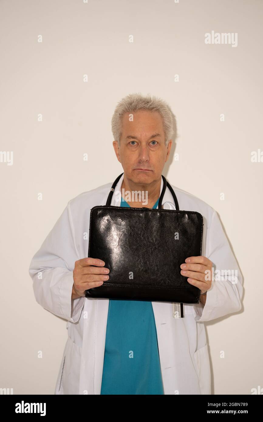Criminal doctor posing for a mug shot Stock Photo - Alamy