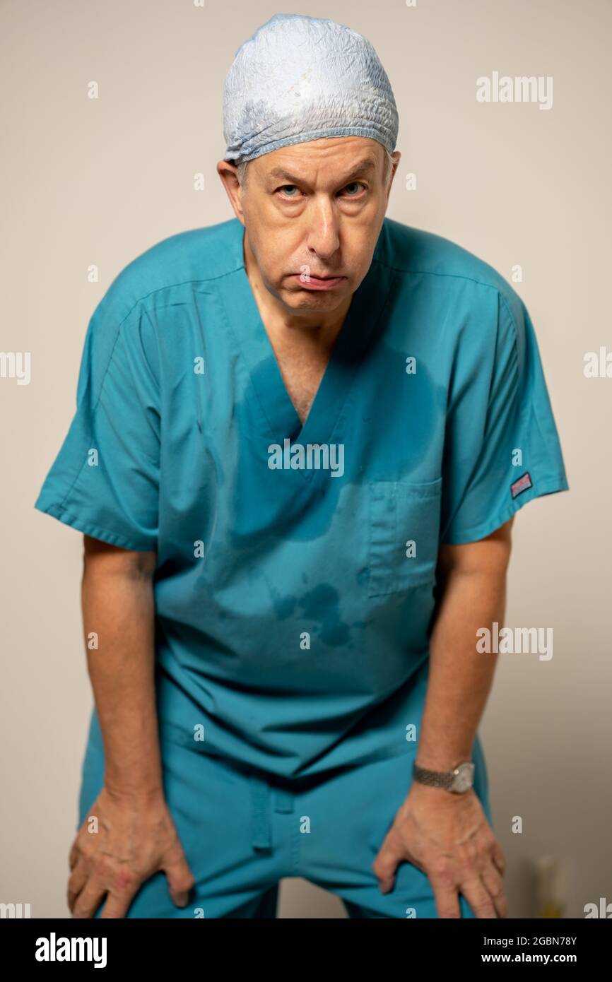Photo of a cardiothoracic surgeon tired after surgery Stock Photo - Alamy