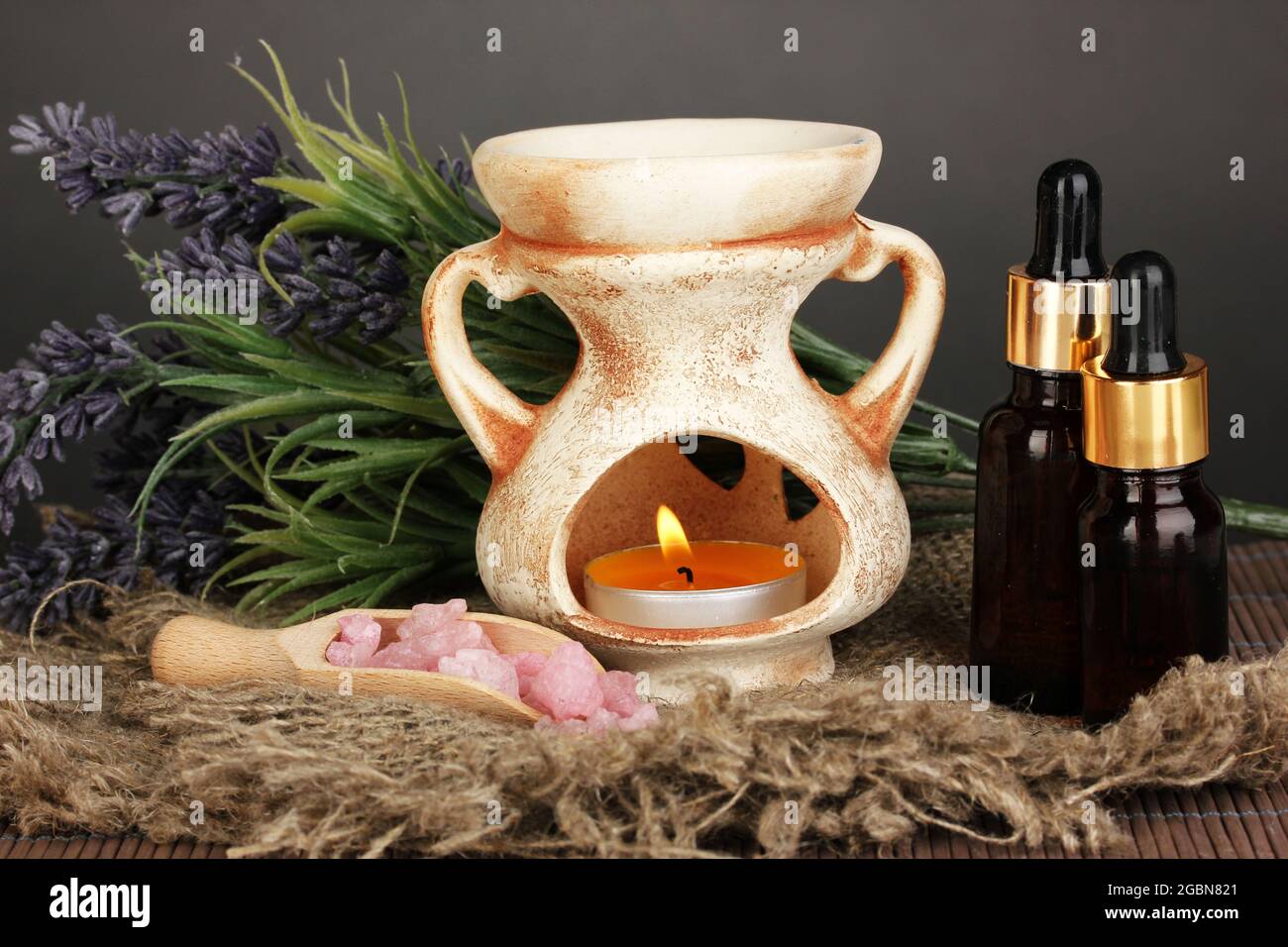 Aromatherapy lamp on grey background Stock Photo - Alamy