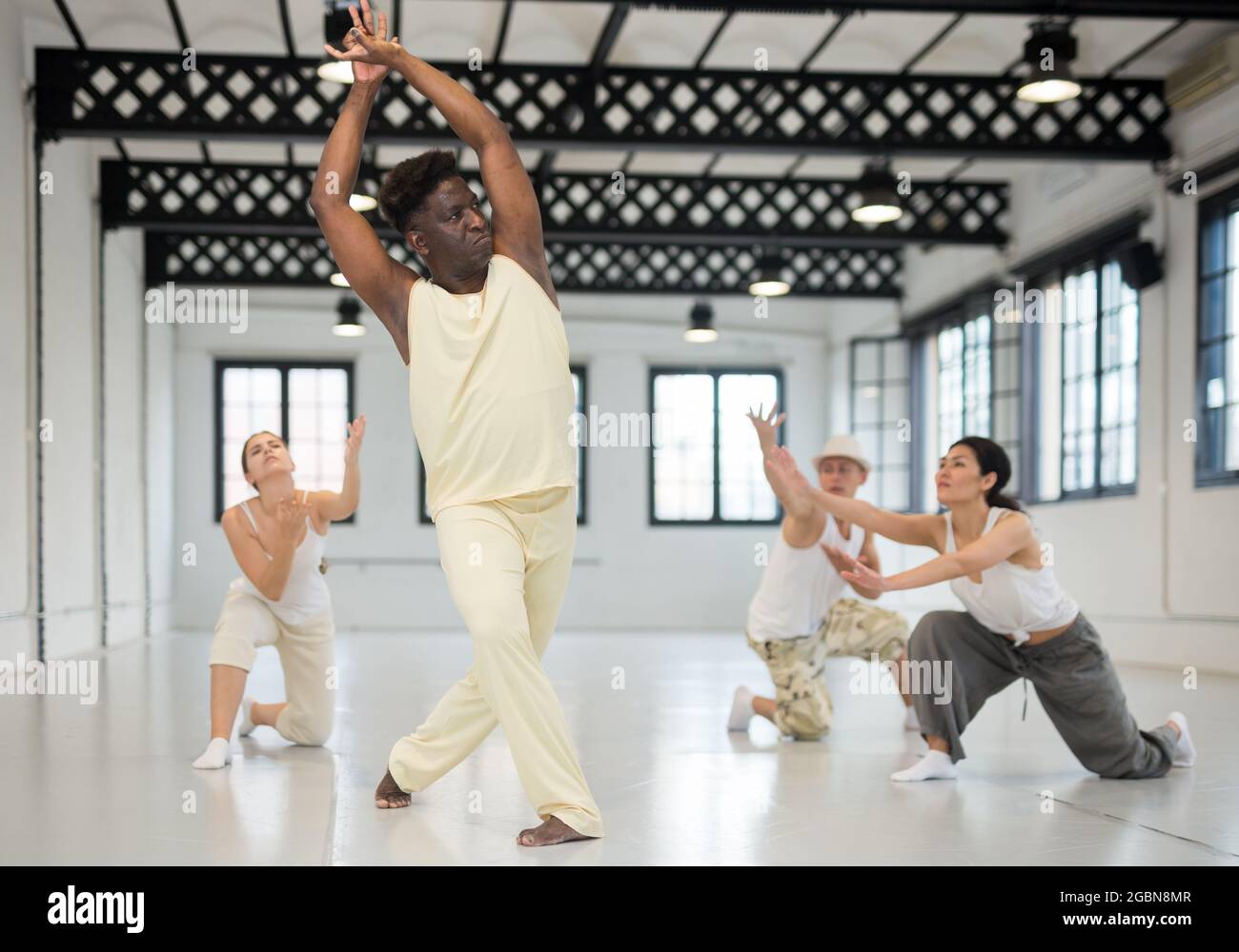 Dancers perform theatrical dance in classroom Stock Photo - Alamy
