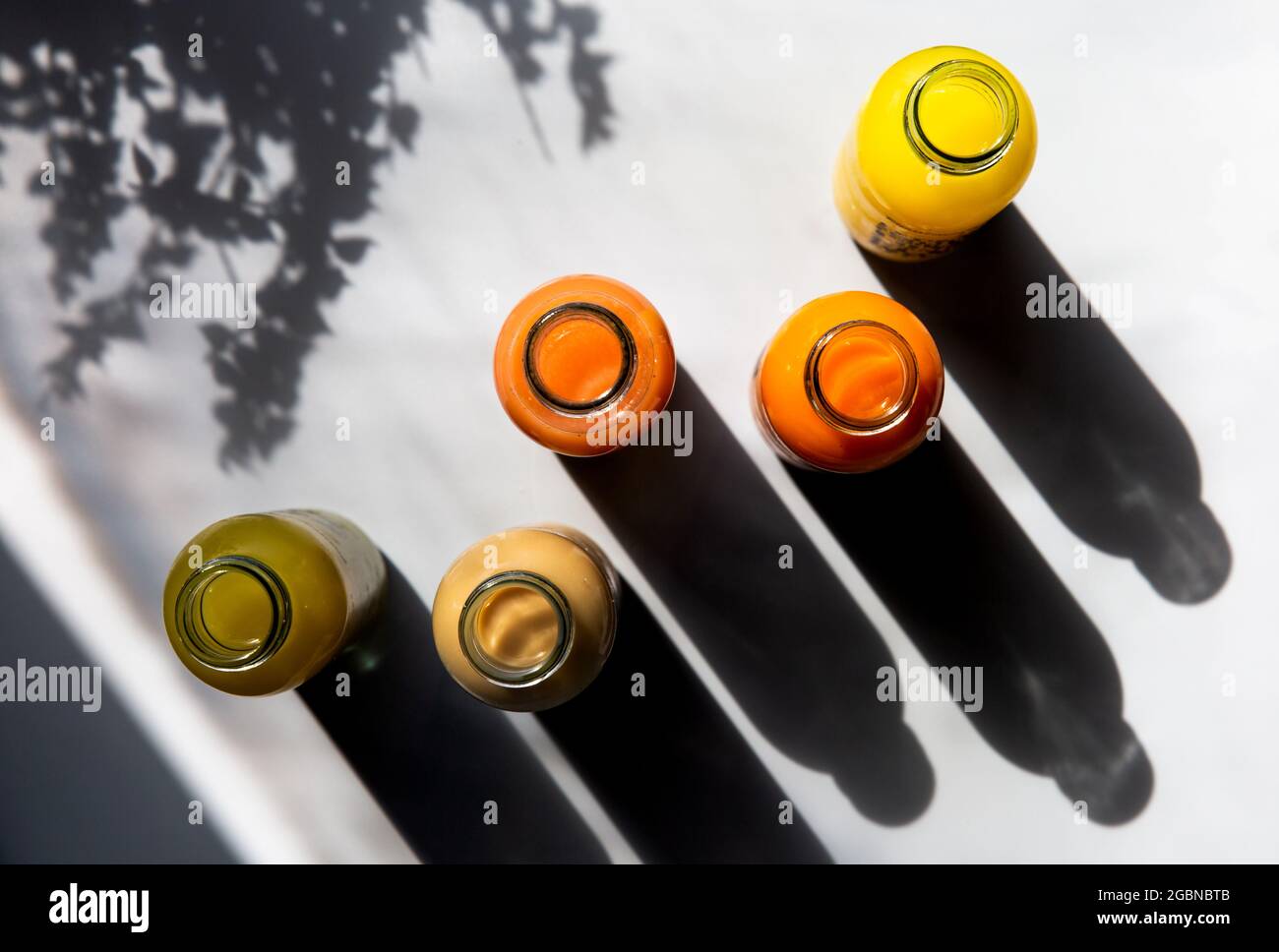 Top view of fresh fruit juice bottles on a white background Stock Photo ...