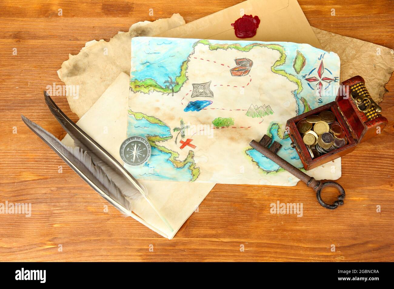 map of treasures on wooden background Stock Photo - Alamy